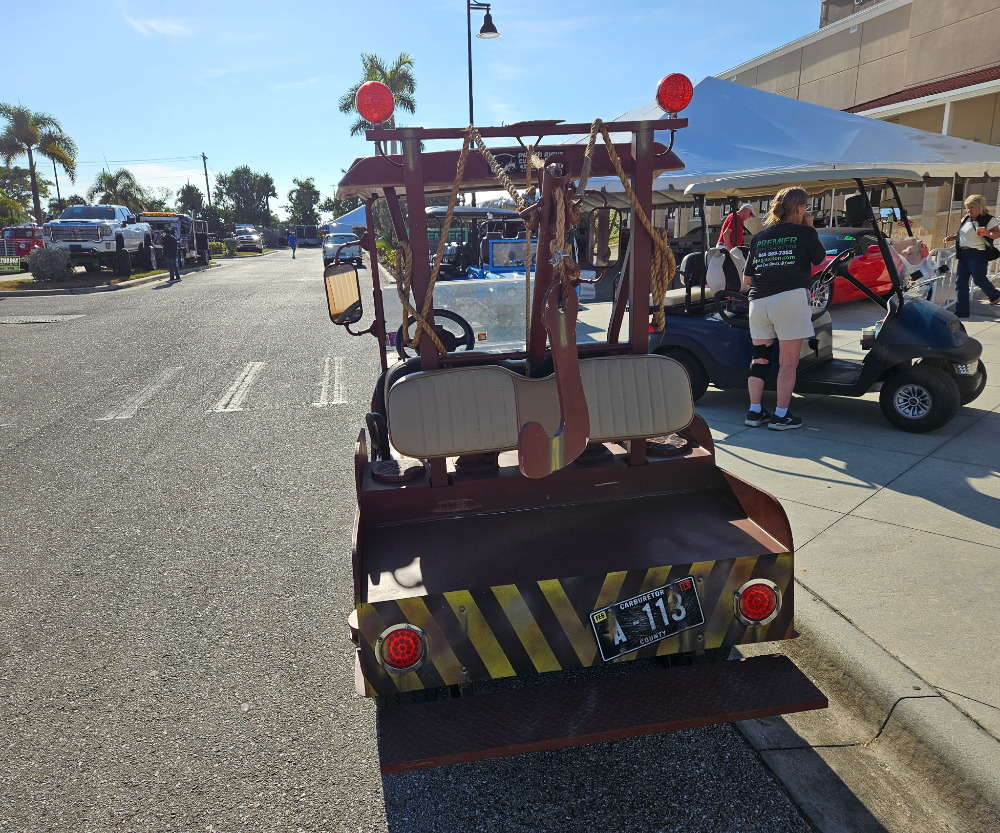 Lot D25-399 - EZGO RXU Custom Built Tow Mator | Premier Auction Group