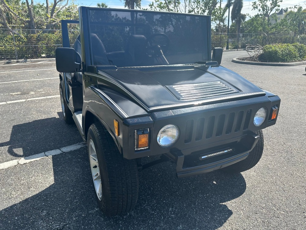 Lot M23-095 - 2009 ACG Hummer H3 Golf Cart | Premier Auction Group