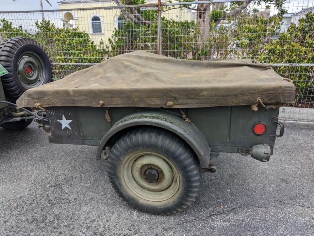 Lot M23-410 - 1954 Willys Military Jeep with Trailer | Premier Auction Group